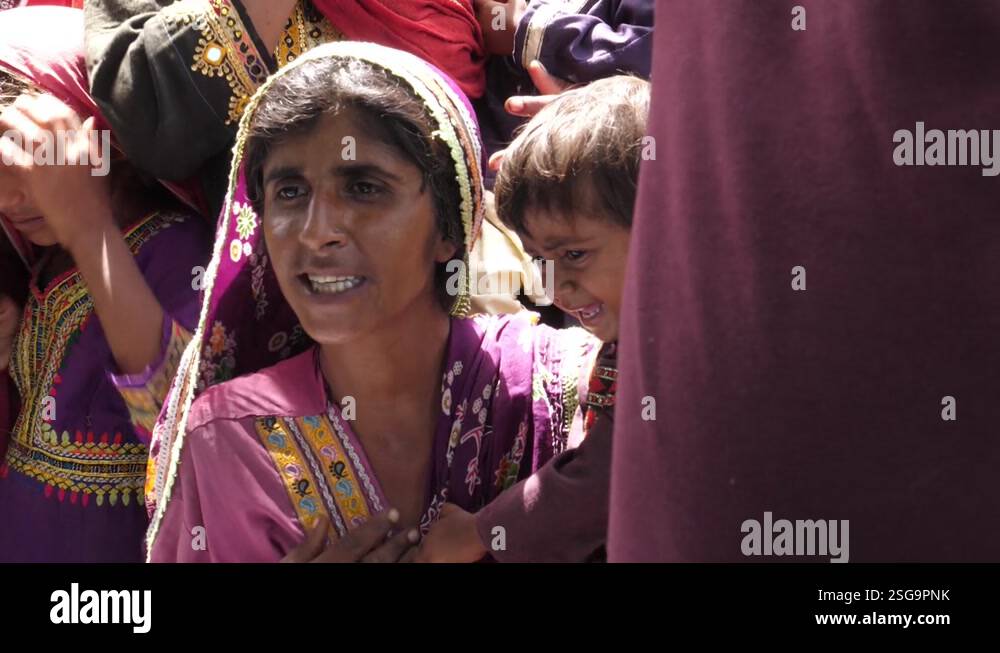 Mother With Crying Child Talking At Flood Relief Camp In Sindh ...