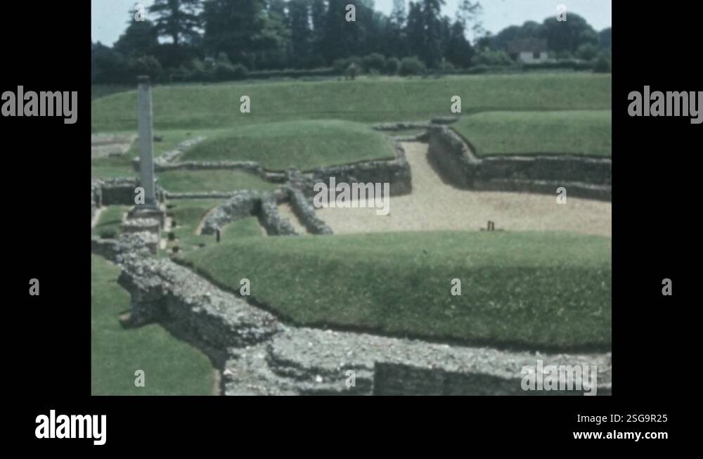 1960s: Obelisk stands in archeological ruins of Roman city. Man in ...