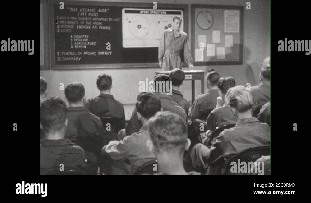 1940s:Moderator stands at front of classroom and talks to group of men ...