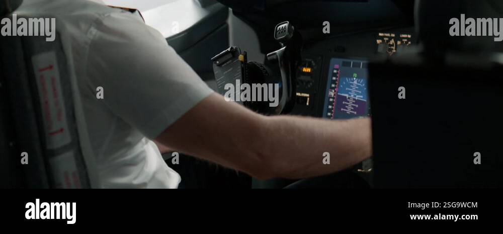 Commercial aircraft pilots controlling the plane during flight at high ...