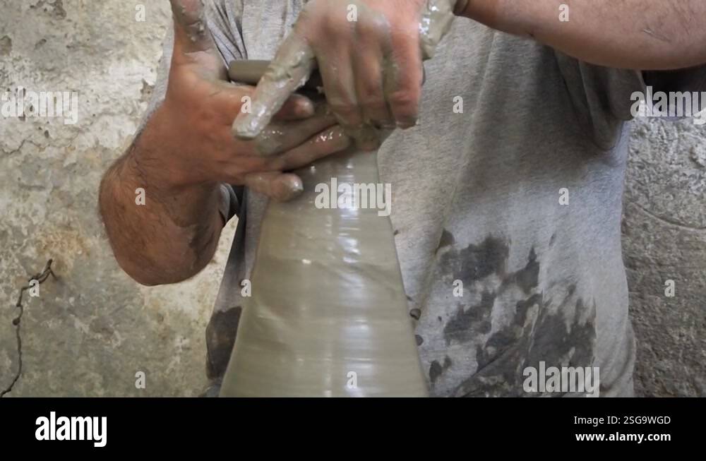 4K Footage of ceramic manufacture man making handcrafted potteryn in a ...