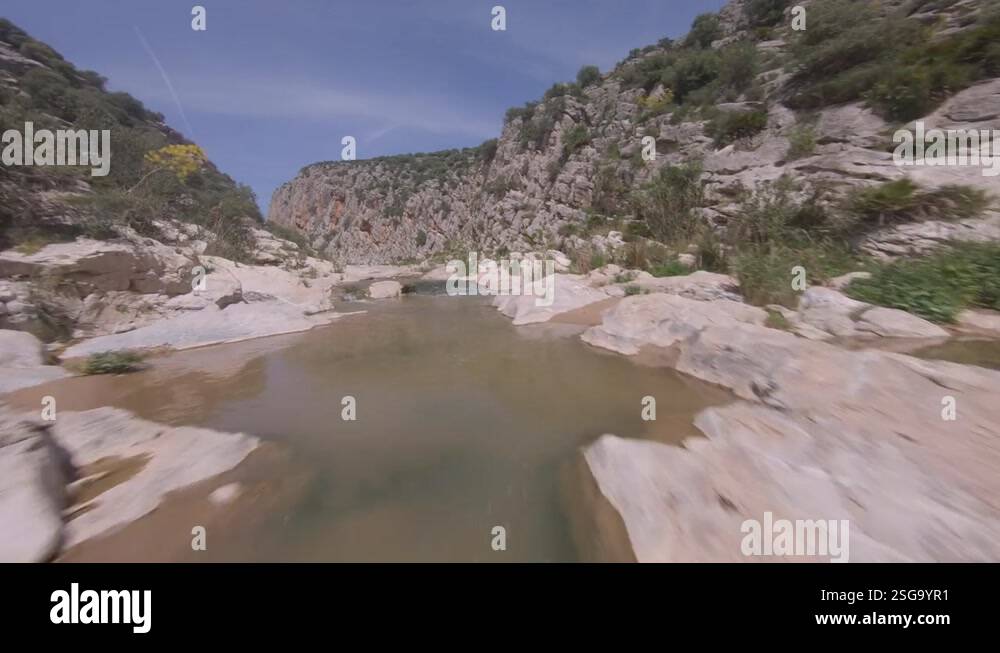 Rugged geological erosion of narrow rock canyon chasm, FPV drone Stock ...