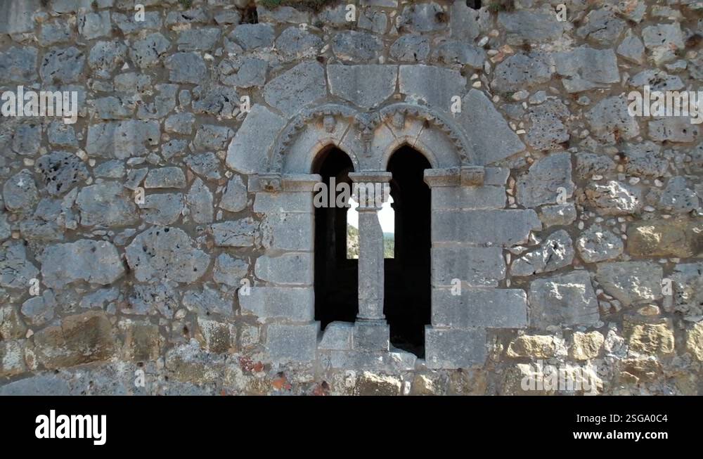 Geminated stony window in a splandid medieval tower backward view ...