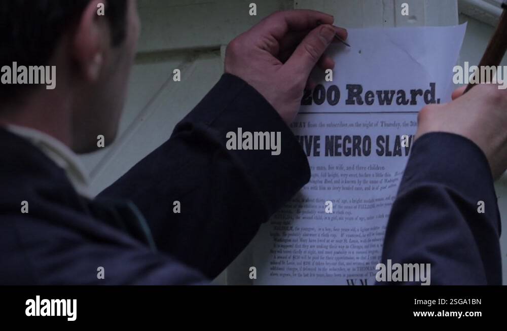 19th Century Man posting a Slavery Notice to a Wall - Slaves Running ...