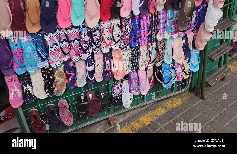 Video of a market stand rack with many types of women's sandals for ...
