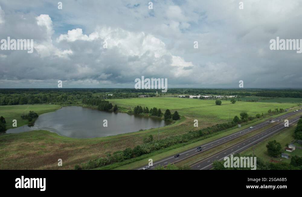 Drone footage from a cloudy day shows numerous cars travelling speedily ...