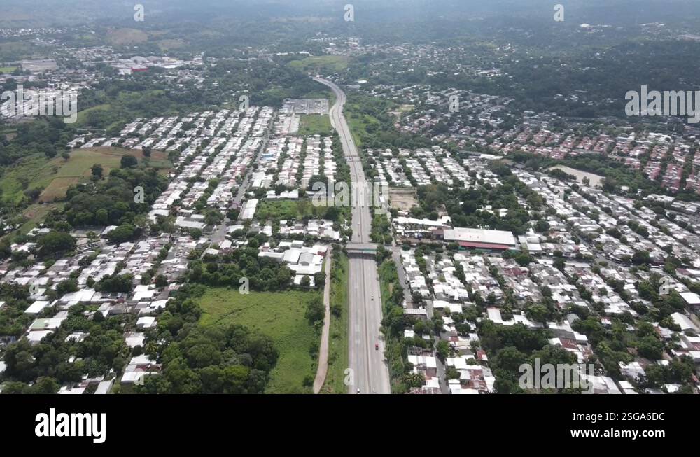Aerial view of a highly populated area in the vicinity of a highway ...