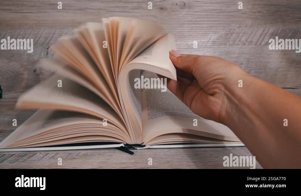 Turning Pages in a White Book Close Up Slow Mo Stock Video Footage - Alamy