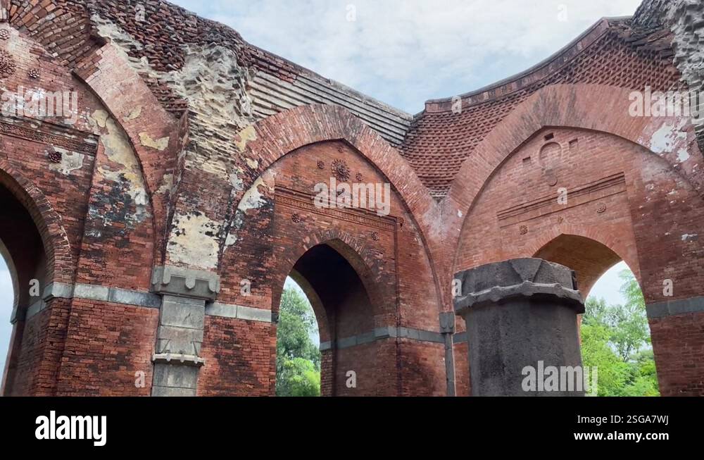 The crumbling remains of a broken hall with stone arches at the ...