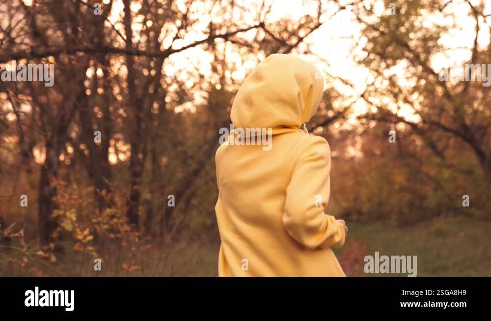 young girl run autumn forest. sun glare bokeh. lose weight while ...