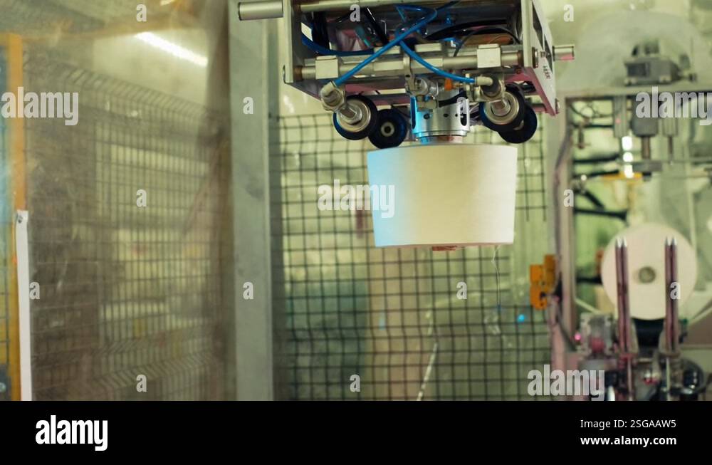 Yarn creel spools getting packed in an automatic machine in textile ...