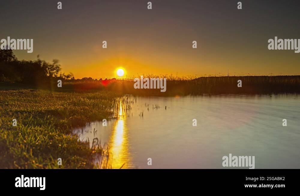 Shot of high tide to low tide with the view of sun setting in the Stock ...