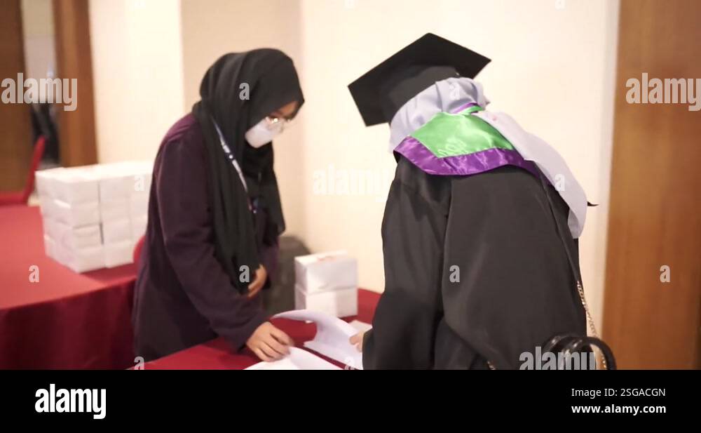 Graduation woman hand signing guest book with pen. They attend ...