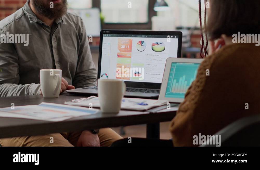 Multiethnic group of colleagues working on charts analysis Stock Video ...
