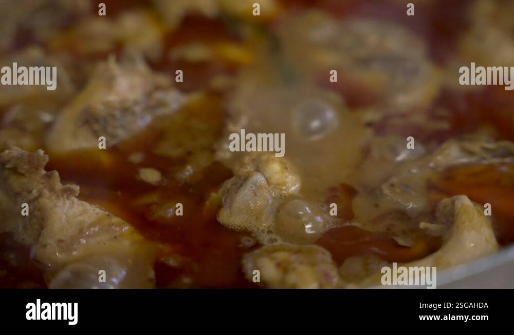 Close Up View Of Steaming Hot Bubbling Chicken Curry. Slow Motion Stock ...
