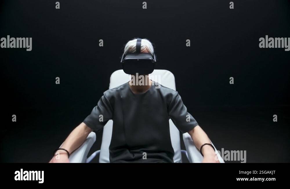 Involved man starting vr headset experience dark room. Player prepare ...