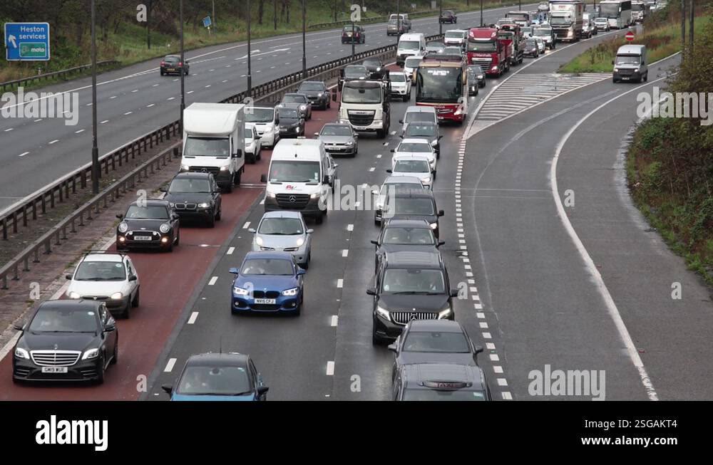 Busy build up of heavy, slow moving morning rush hour traffic on the M4 ...