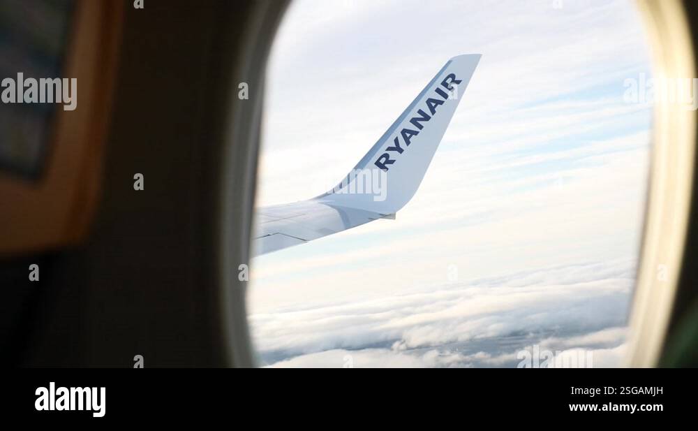 Ryanair Airplane Wing Above Clouds Seen Through Window During Flight ...