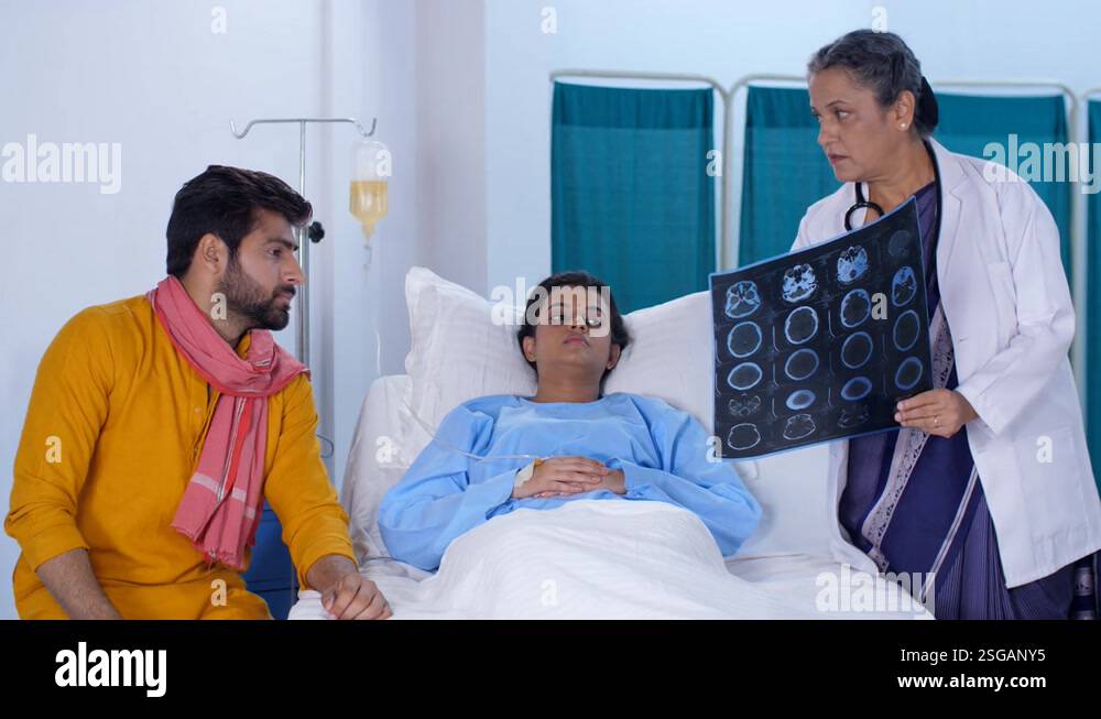 A middle-aged Indian lady doctor consulting - CT scan of head and brain ...