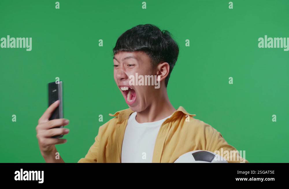 Close Up Side View Of Asian Boy With A Ball Screaming Goal Celebrating ...