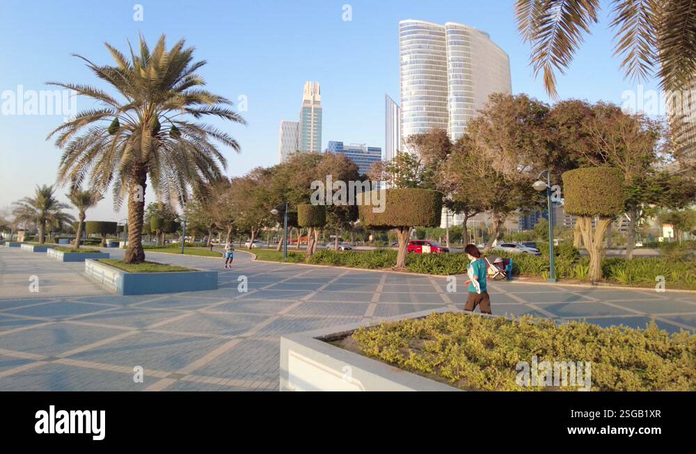 People on Corniche running and walking by, healthy lifestyle concept ...