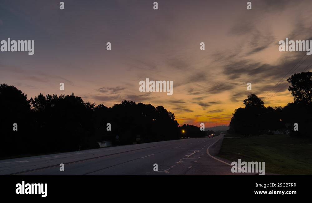 Traffic at sunrise early morning golden hour rural highway Georgia USA ...
