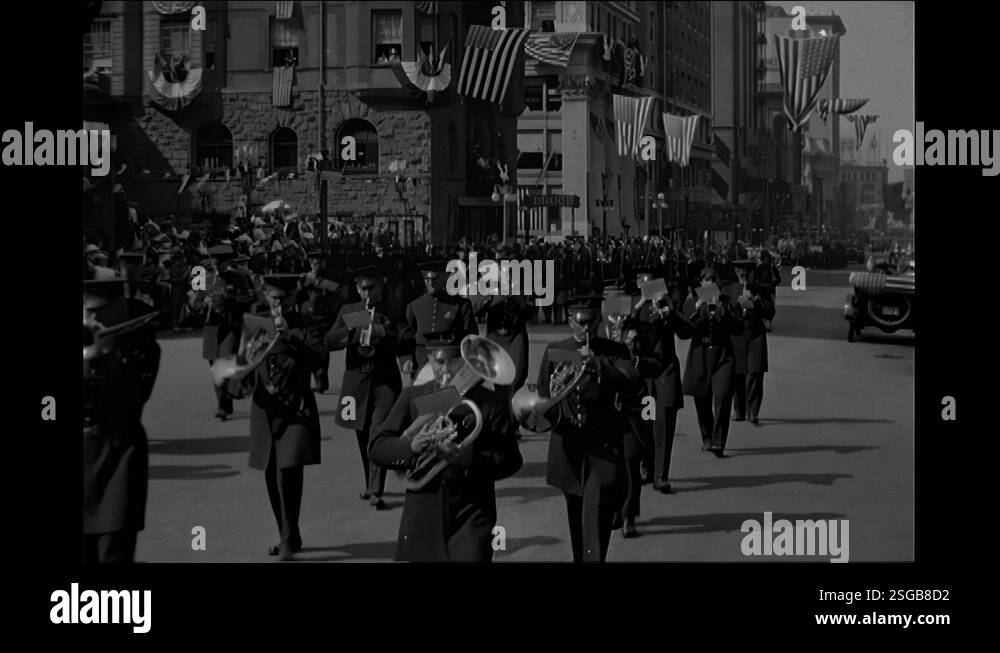 1930s: Marching band parading on city street. Soldiers marching in road ...