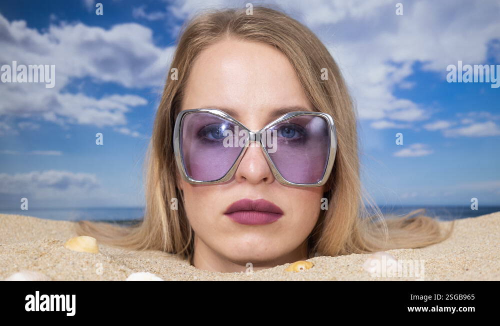 Woman buried in sand on beach with sunglasses Stock Video Footage - Alamy