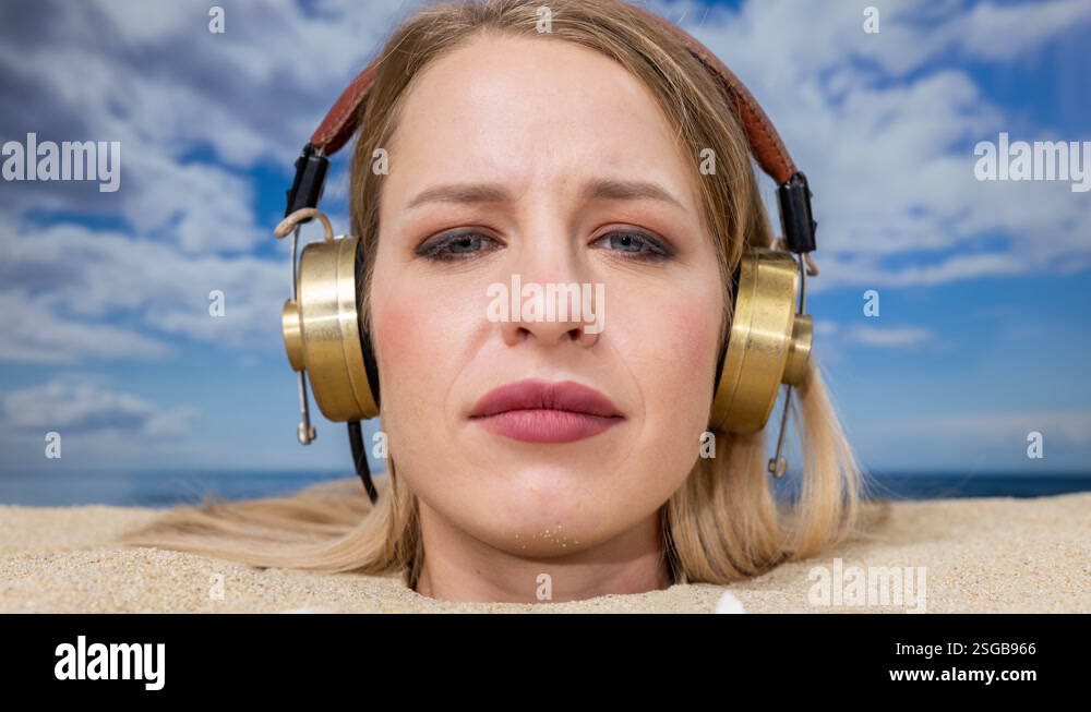 Woman buried in sand on beach Stock Video Footage - Alamy