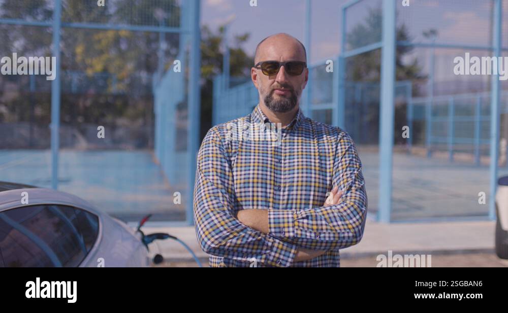 Portrait of a bold man with beard in business casual outfit wearing ...
