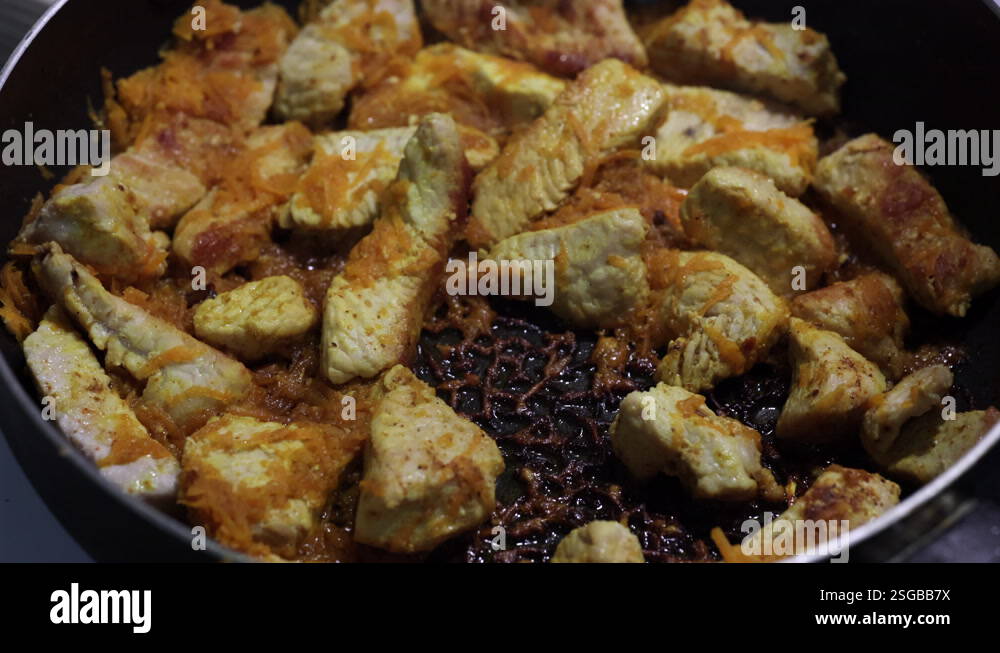 Pieces Of White Meat Are Fried In A Frying Pan On A Kitchen Stove. 60 ...