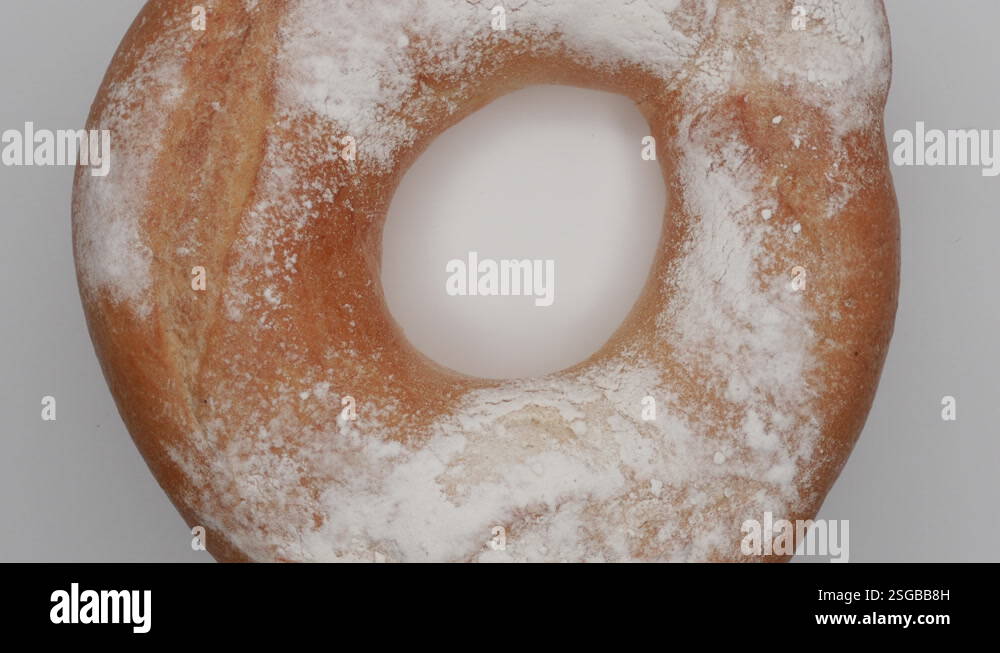 Loaf Of Bread Rotating On A White Plate On Turntable Top View. Close Up ...