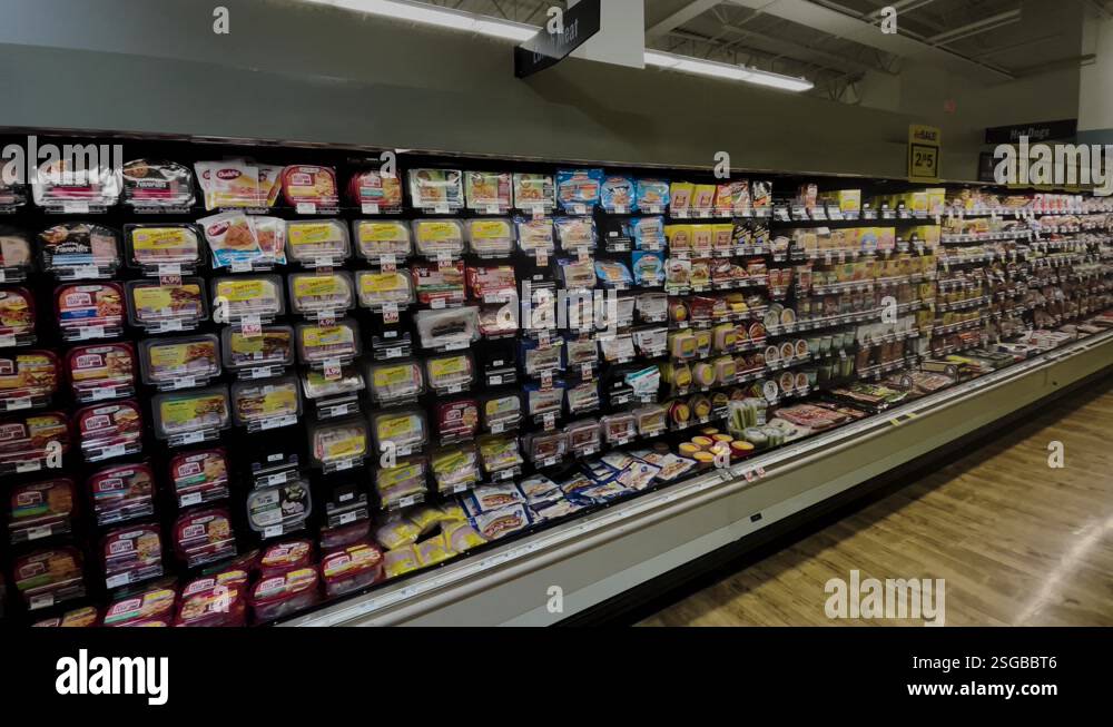 Grocery store sandwich lunch meat case early morning dim light full ...