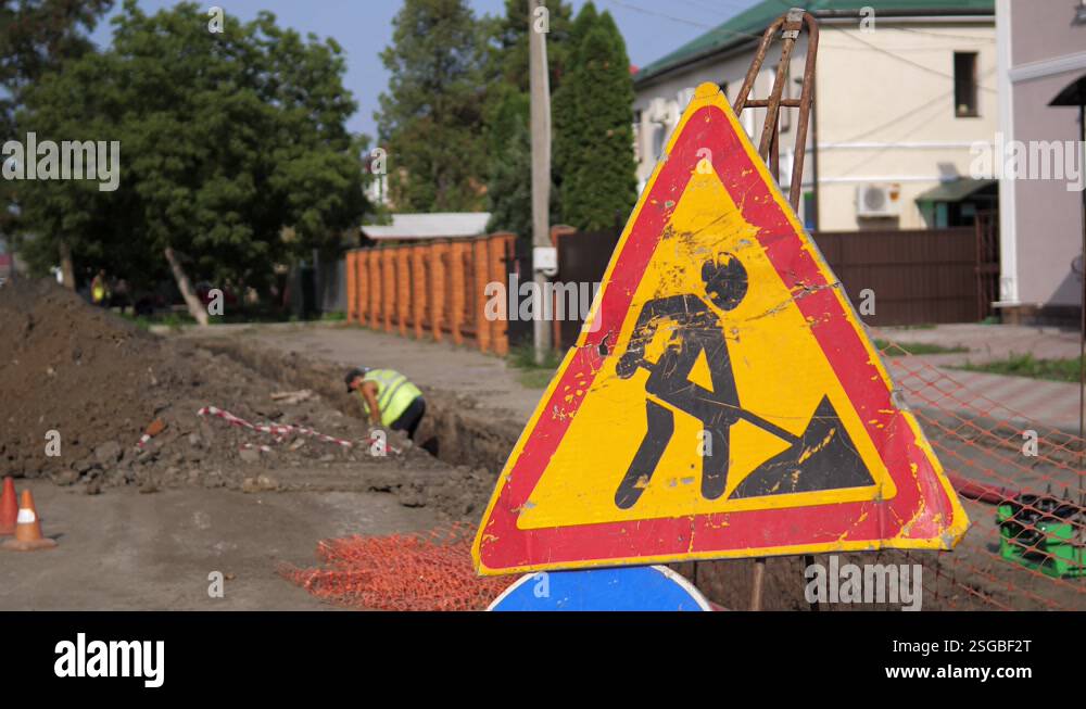 Warning signs for work in progress on closed road under construction ...