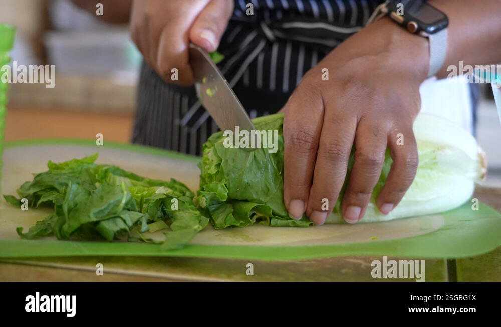 Slicing romaine lettuce for a chopped salad - close up ANTIPASTO SALAD ...