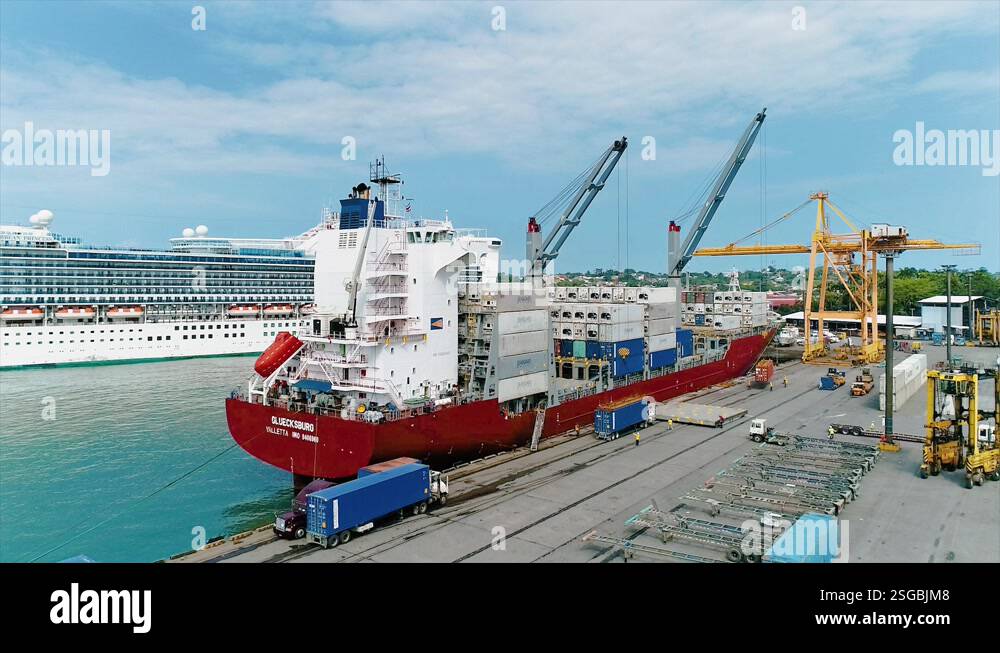 Crane Ship Unloading Containers From Vessel Loading To Trucks At The ...