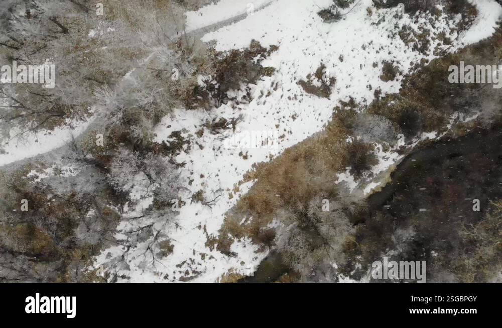 River and Walking Path with Falling Snow • HD Aerial Drone Shot ...