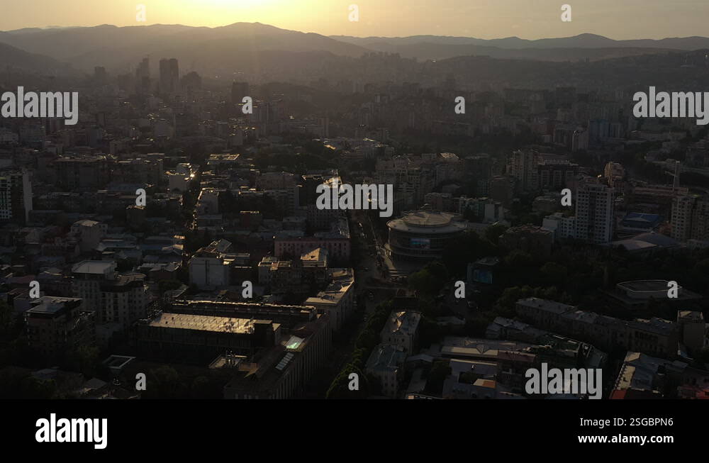 sunset tbilisi city old town main street traffic aerial panorama 4k ...
