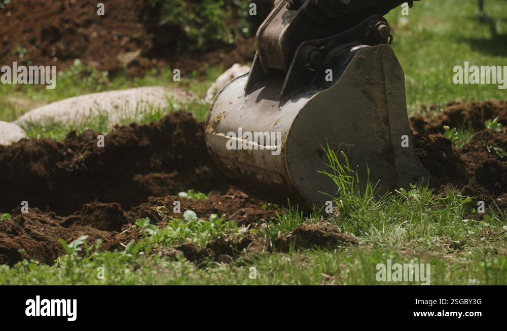 Mini excavator bucket digging. heavy equipment vehicle services. 4k ...