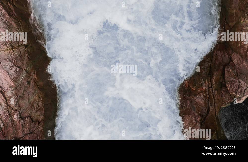 Mountain river. A rapid flow of clean water trapped between rocks ...
