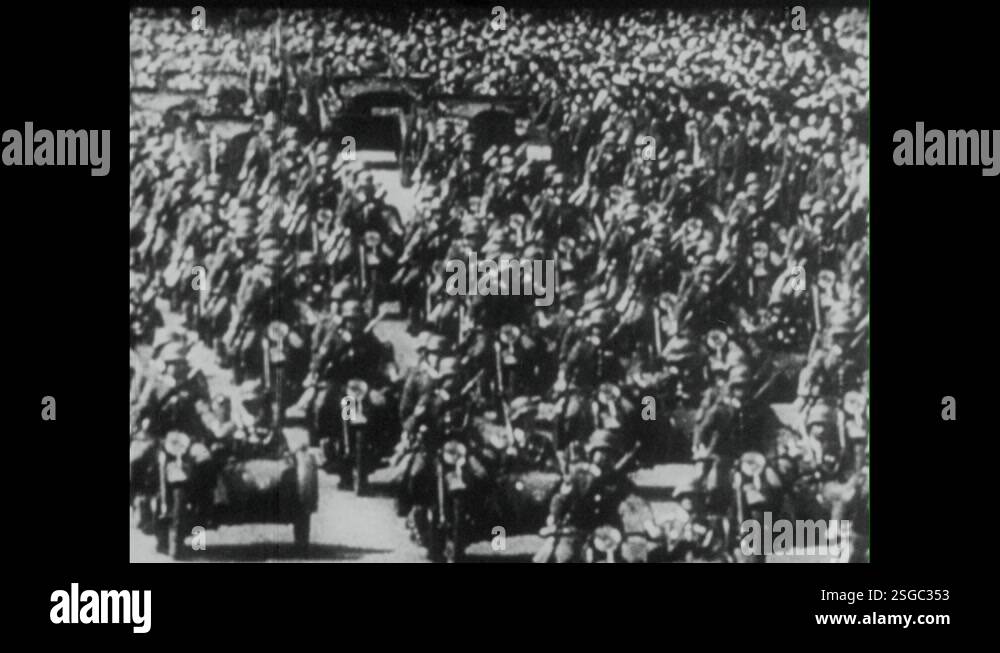 Russia 1940s:Nazi symbol over map. Soldiers march, military vehicles ...