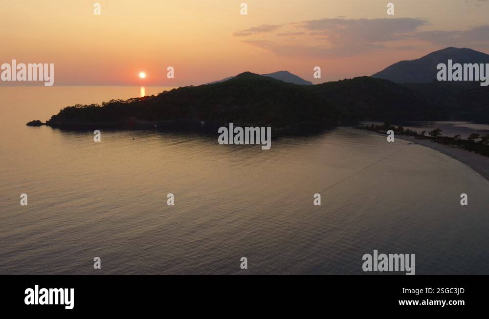 Seaside of evening landscape. Beautiful mountains and sea under sunset ...