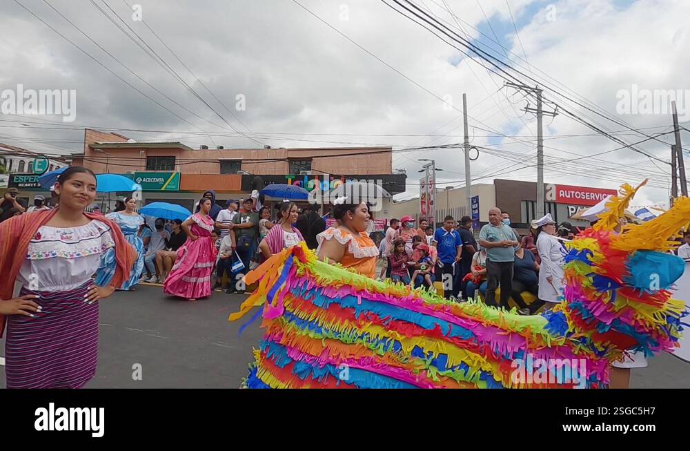 Salvadoran man disguised as a Torito Pinto piñata dances in the middle ...