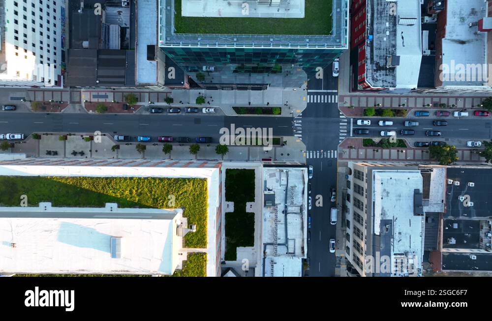 Top down aerial of city street. Allentown PA and American flags. Birds ...