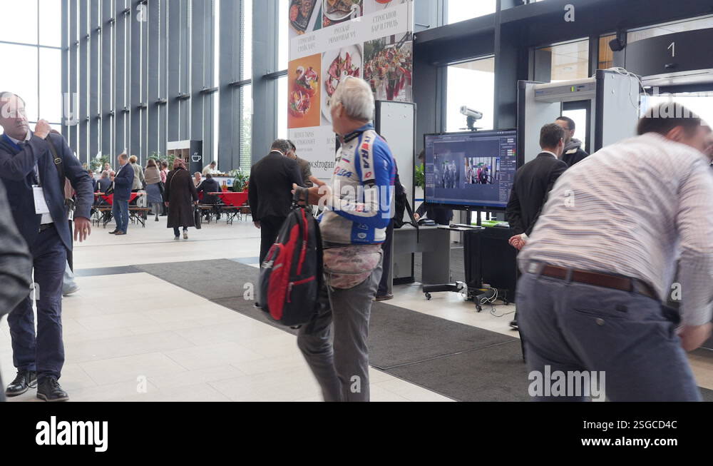 Visitors, people entering at hall at exhibition. Crowd people at hall ...