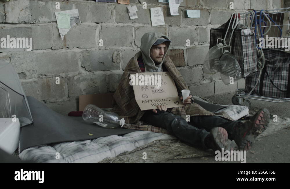Homeless beggar Stock Videos & Footage - HD and 4K Video Clips - Alamy