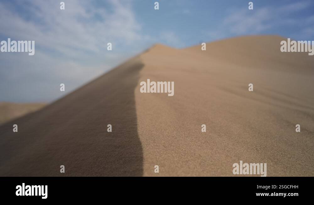 Wind in desert blowing sand and changing shape of dune; Singing Dunes ...