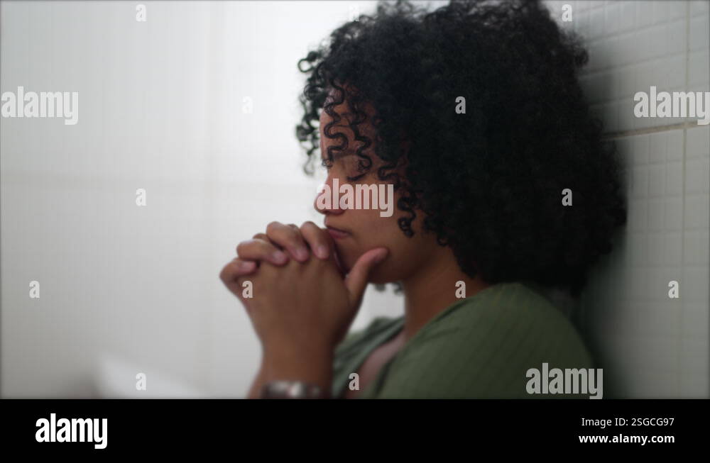 One Brazilian young woman in prayer during difficult times. A South ...
