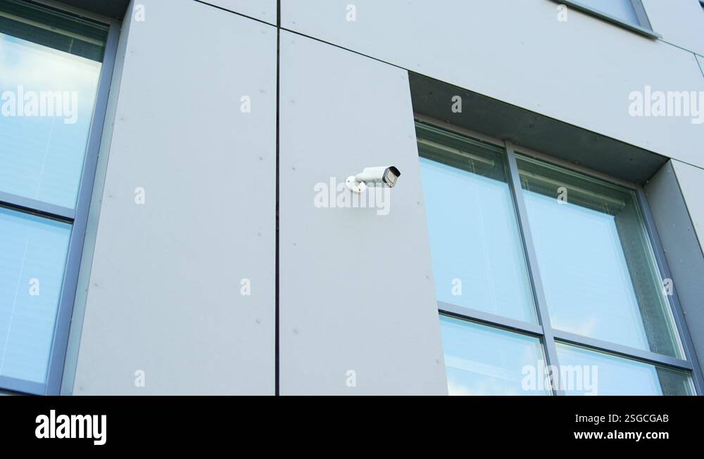 CCTV security surveillance camera built into the metal wall Stock Video ...