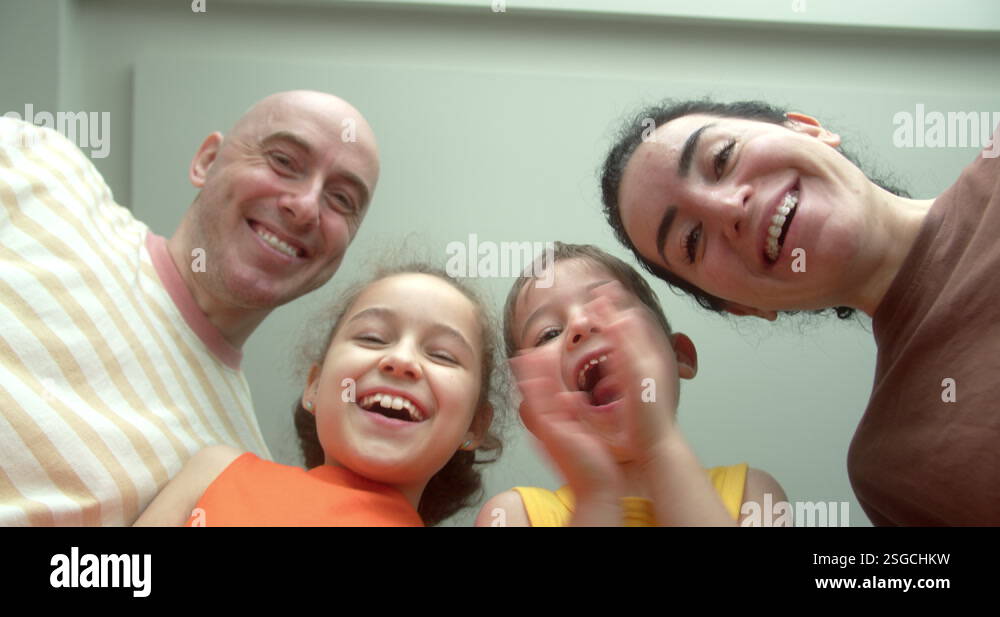 Happy family, Children with their parents overjoyed at the surprise ...